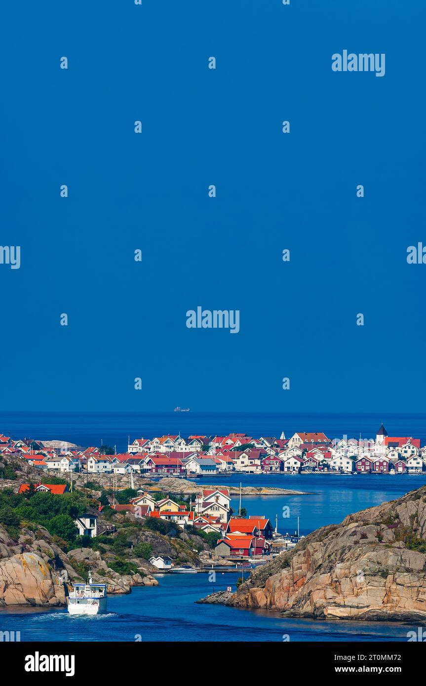A coastal village with clear blue sky and nautical vessels Stock Photo ...
