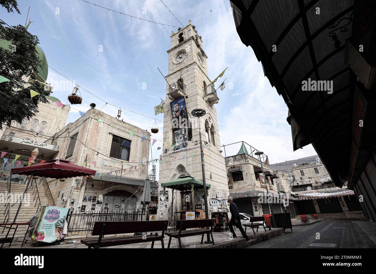Nablus, Palestinian Territories. 08th Oct, 2023. A man crosses a street ...