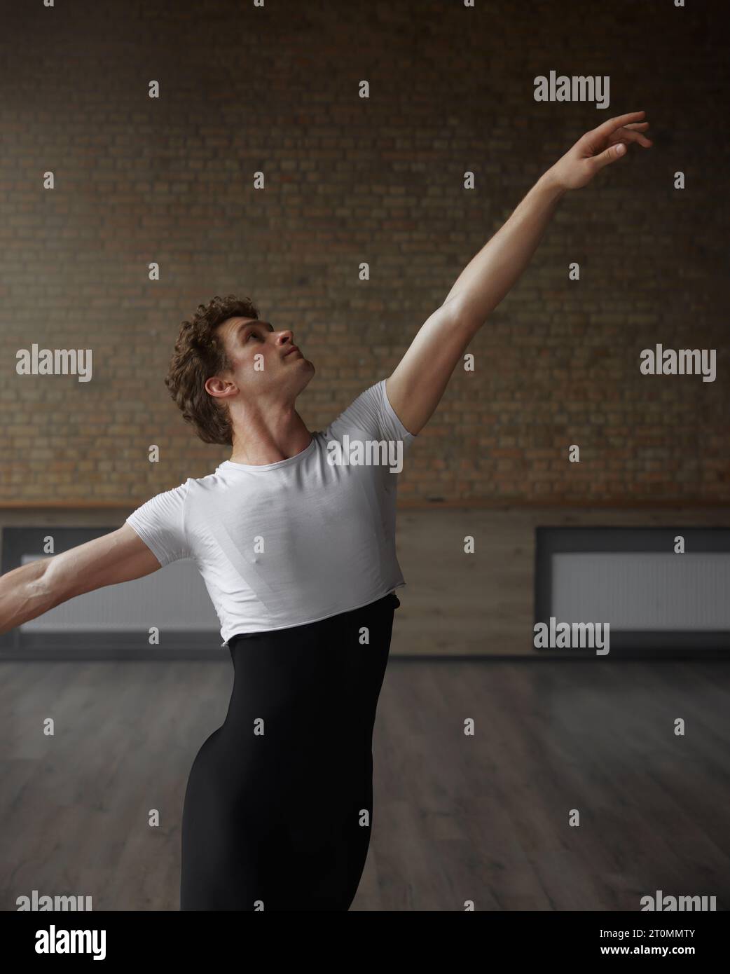 Male dancer practicing in ballet studio holding training class Stock ...