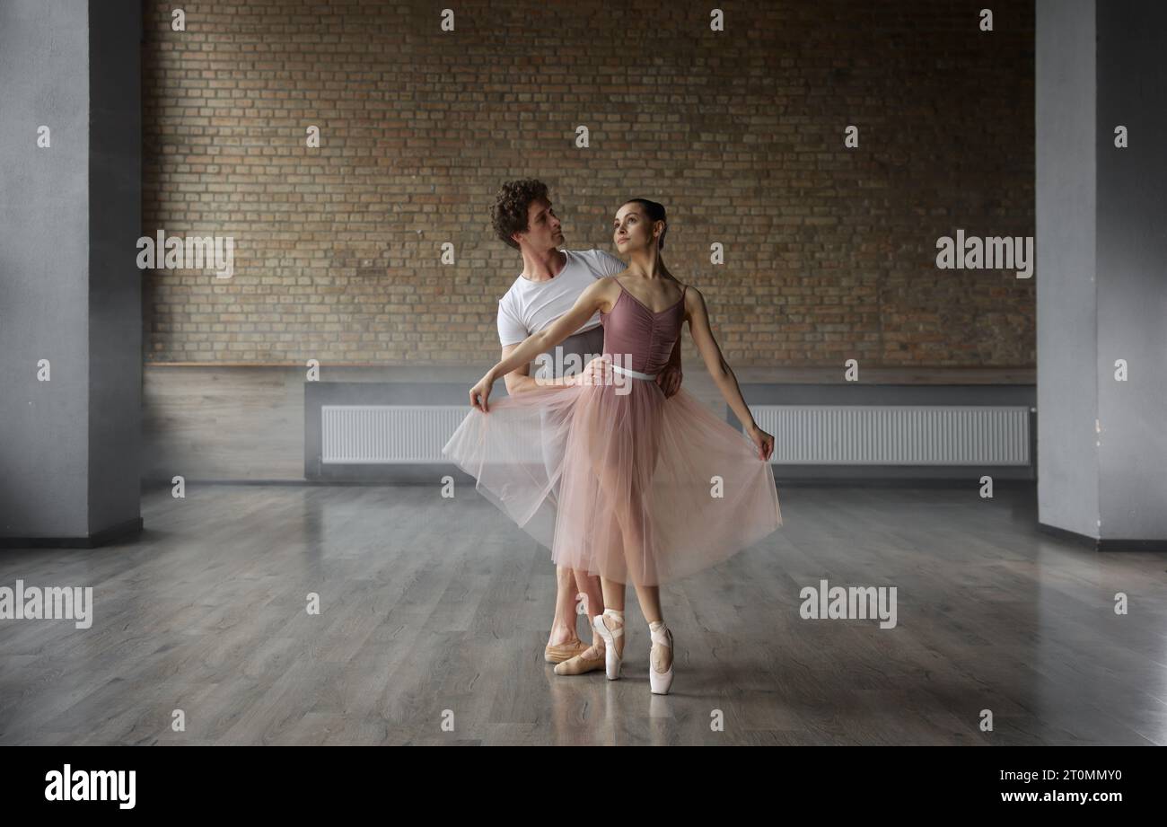 Beautiful young ballet dancers performing choreographic art Stock Photo ...