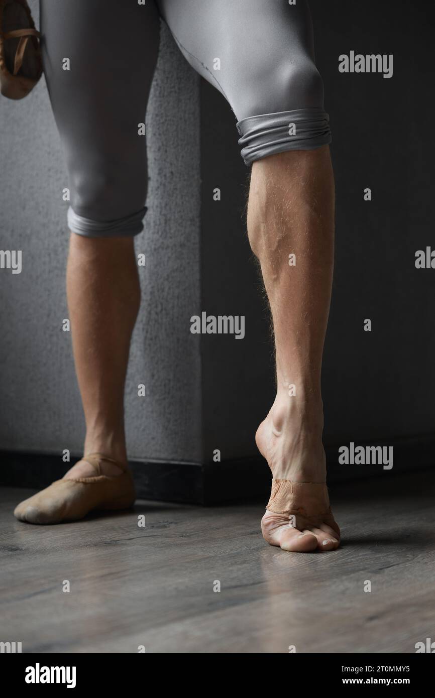 Strong trained legs of male ballet dancer cropped shot Stock Photo - Alamy