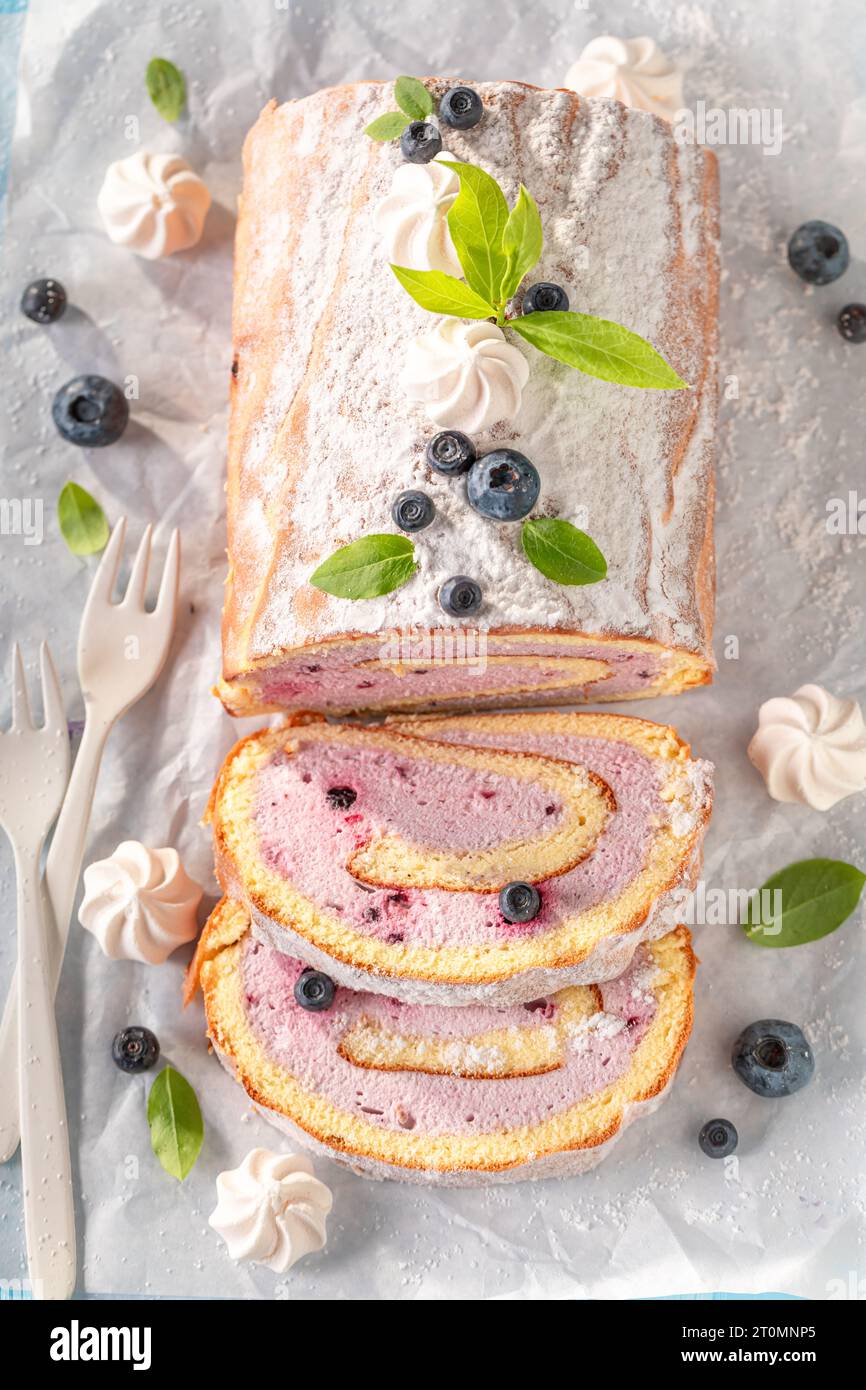 Sweet blueberry swiss roulade made of berry fruits. Mango swiss roll ...