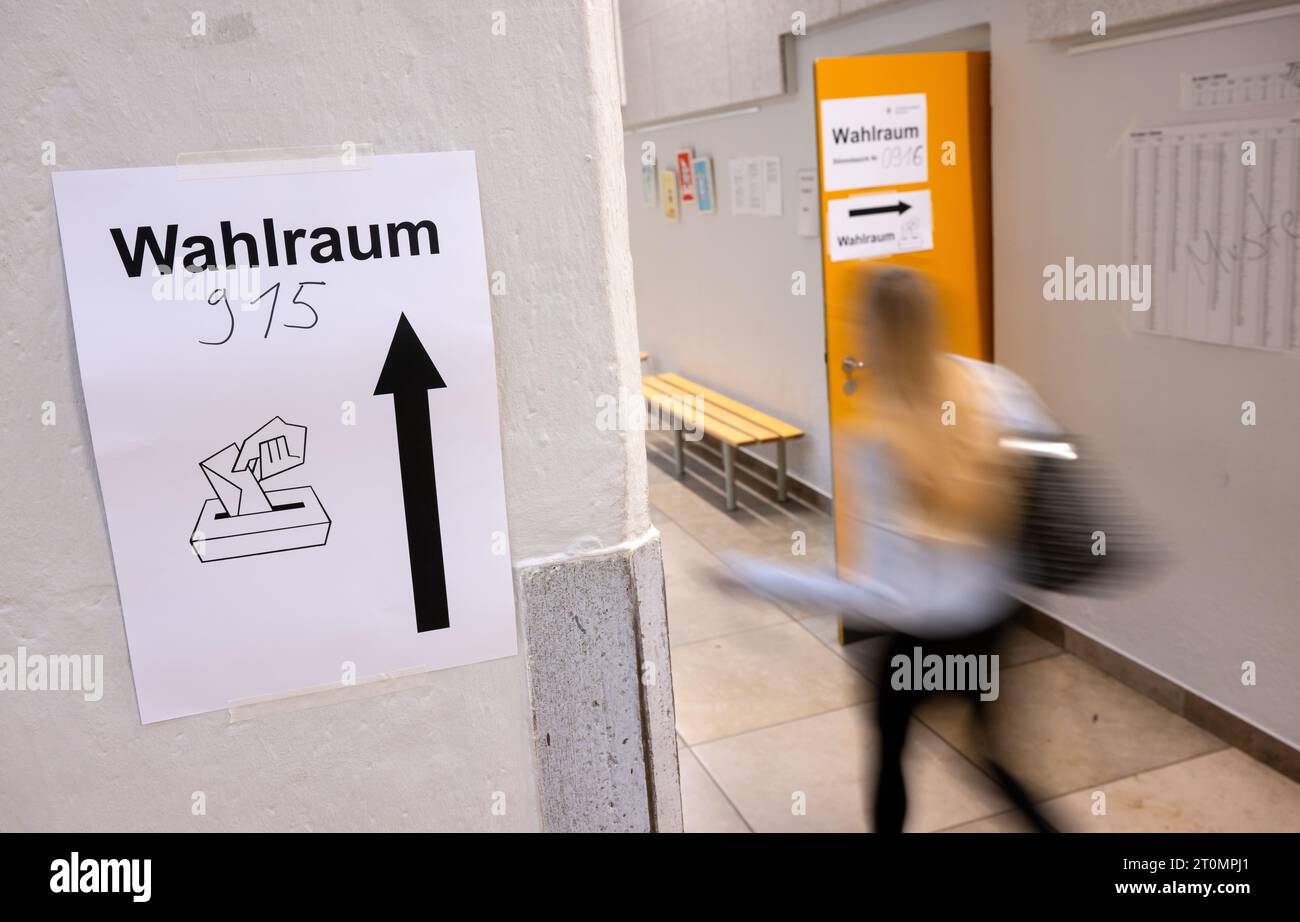 Munich, Germany. 08th Oct, 2023. A woman walks to her polling station ...