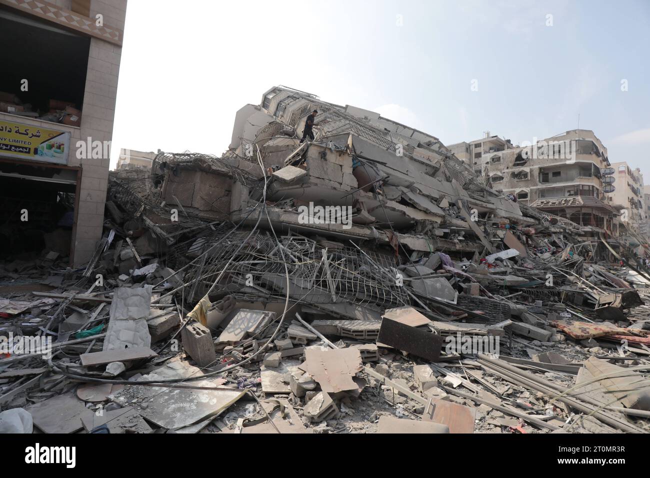 Gaza City, Palestibe. 8th Oct 2023. Palestinians inspect the ruins of ...