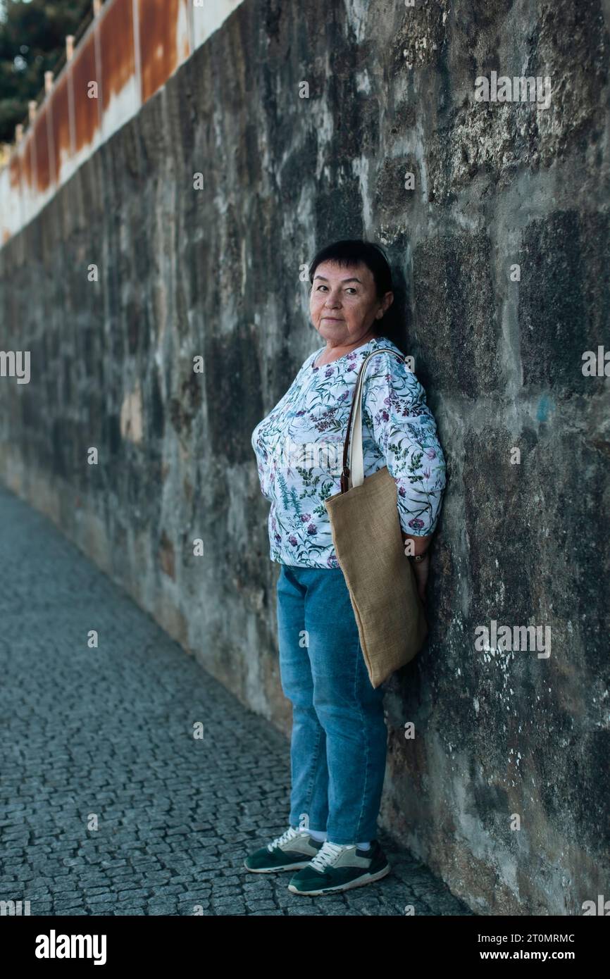 Mature woman stands outside hi-res stock photography and images - Alamy