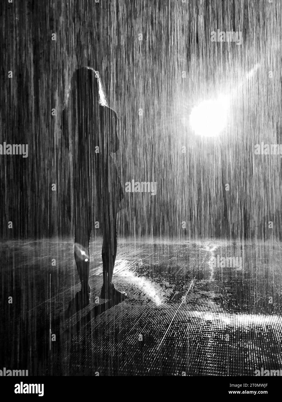 Pouring rain person Black and White Stock Photos & Images - Alamy