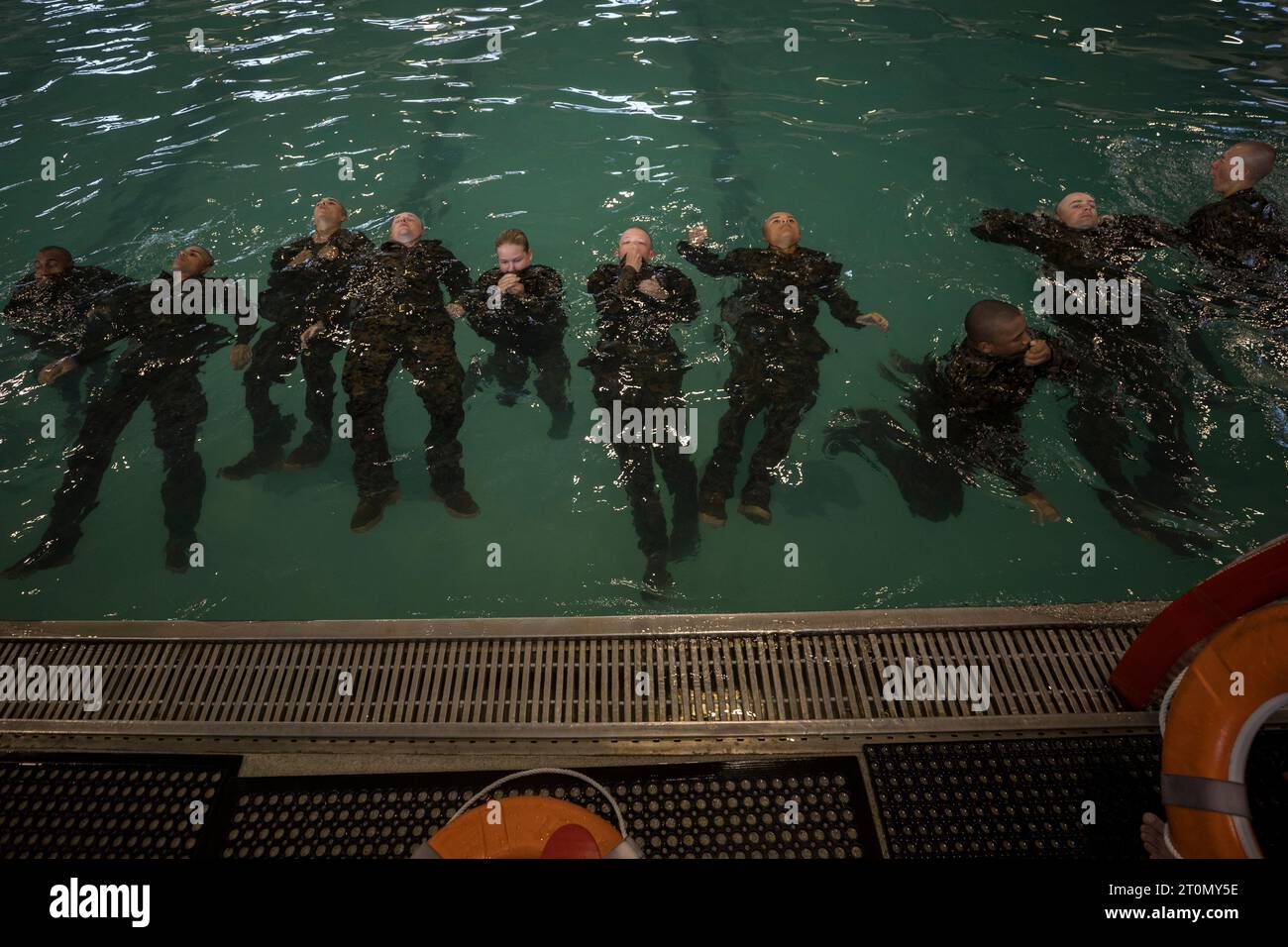 A group of U.S. Marine Corps recruits learn to float during swim ...