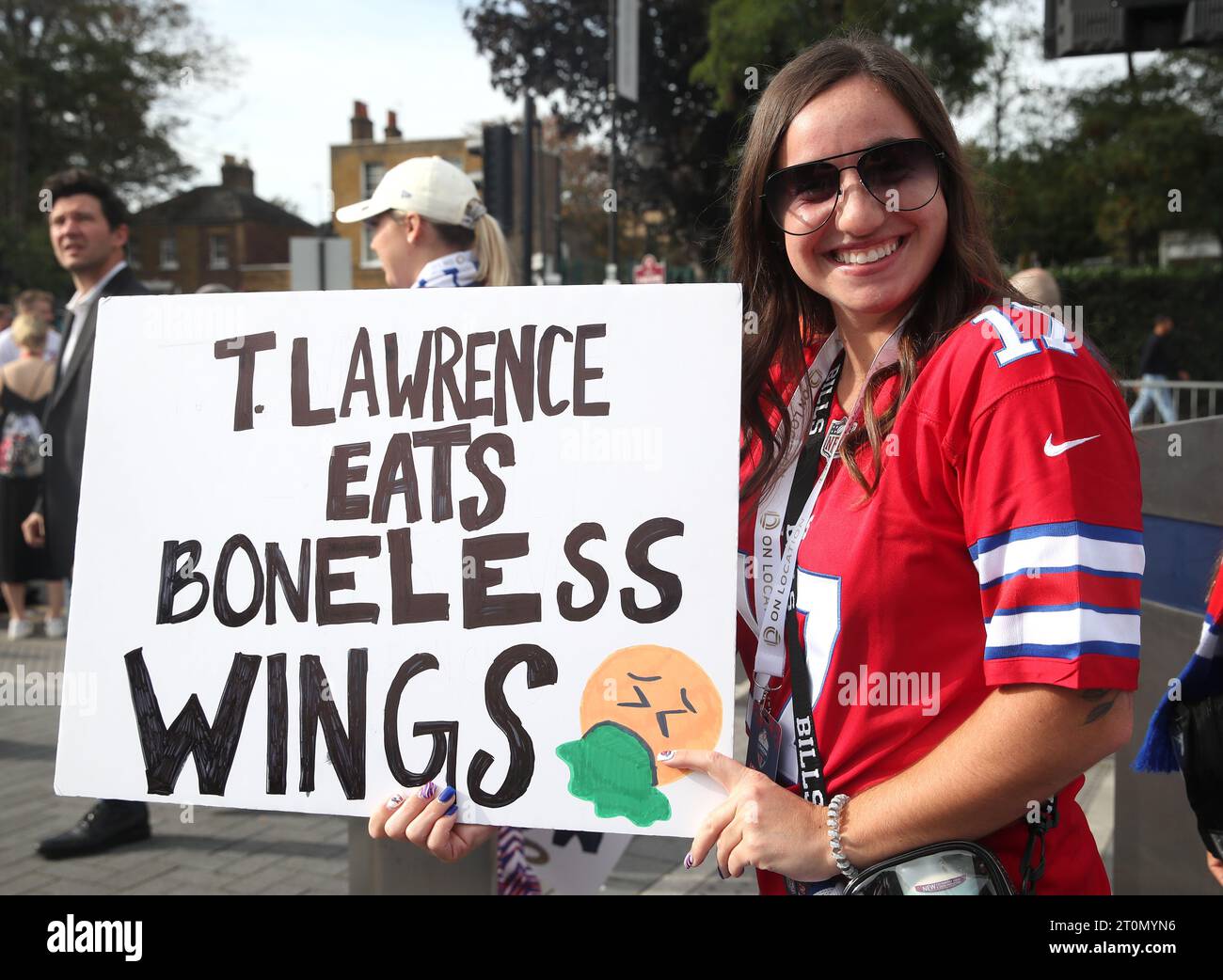 A Buffalo Bills fan holds up a sign about Jacksonville Jaguars ...