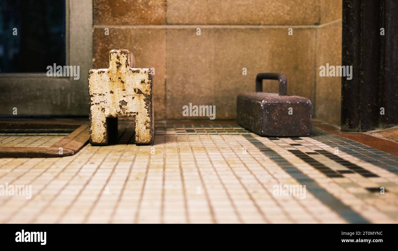 Old iron blocks used as door stops just inside the entrance of the ...