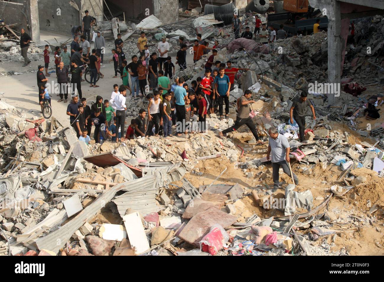 Rafah, Gaza. 08th Oct, 2023. Civilians and rescue teams gather outside ...