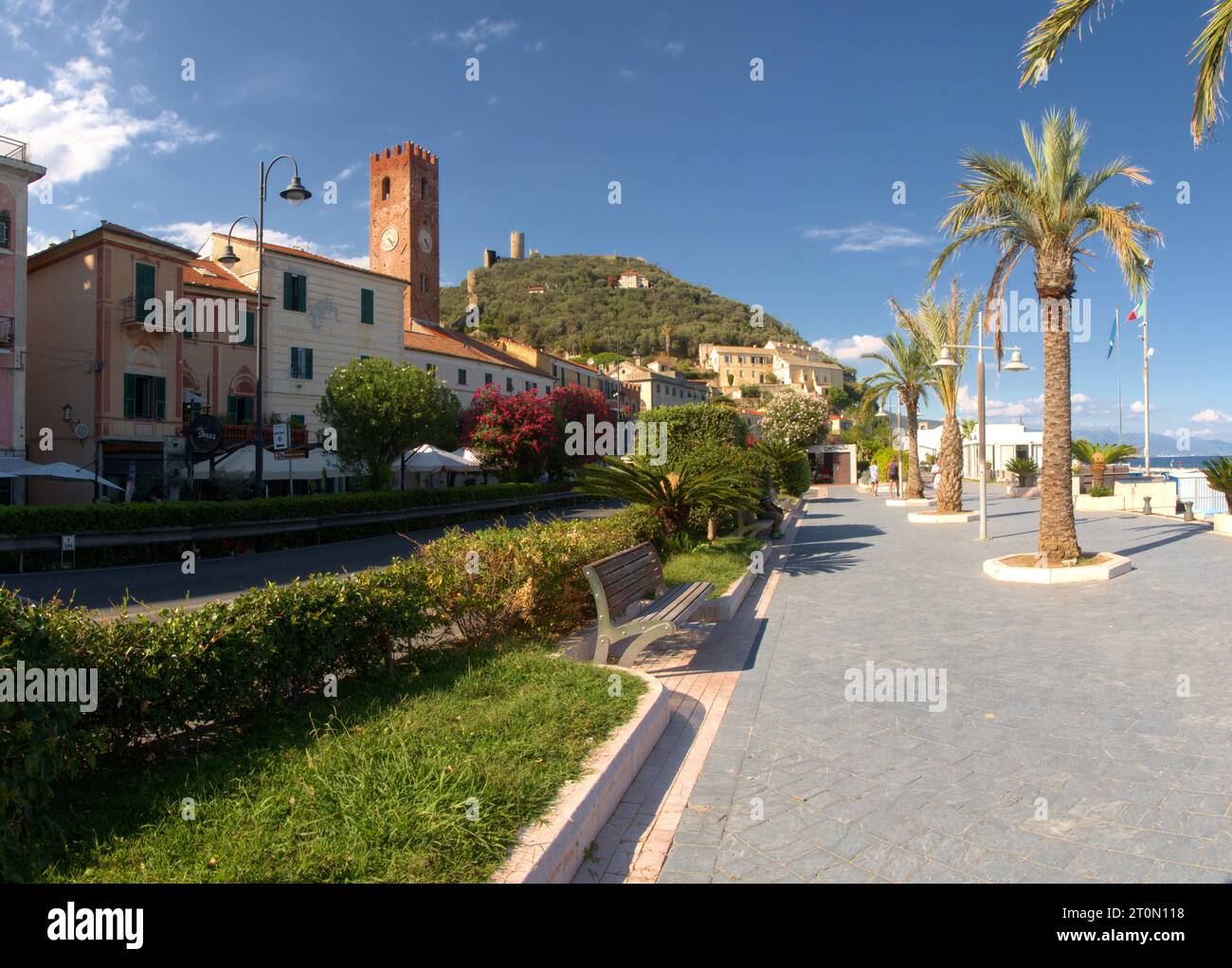 Beach front in Noli showing castle, palms and Torre del Comune, Savona ...