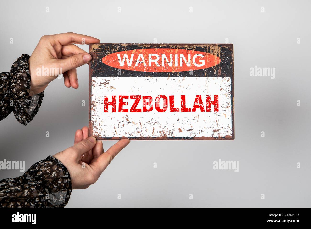 Hezbollah. Warning sign with text in the hands of a woman Stock Photo ...