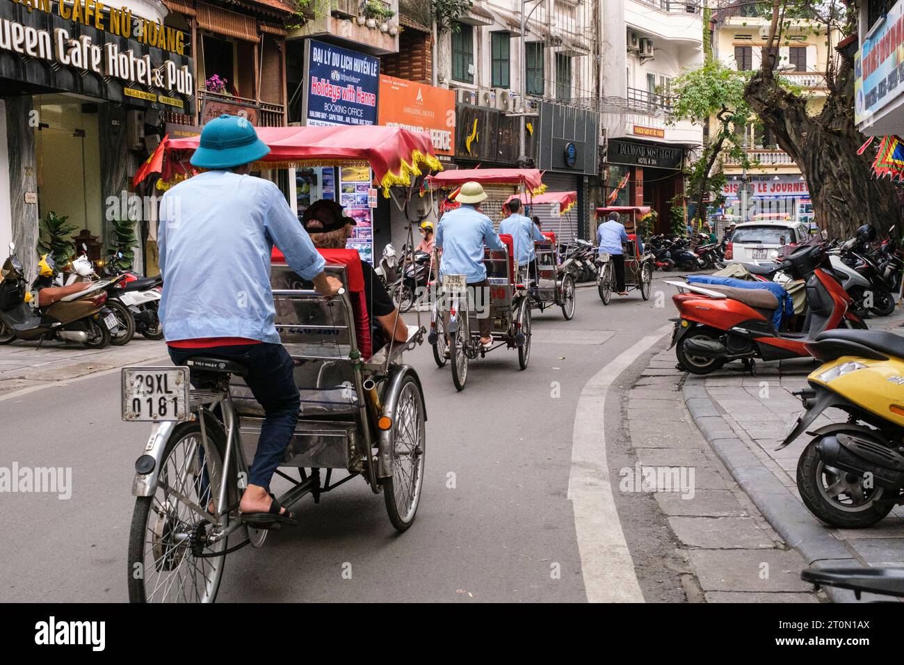Hanoi, Vietnam. Tourists Riding in Cyclos Stock Photo - Alamy