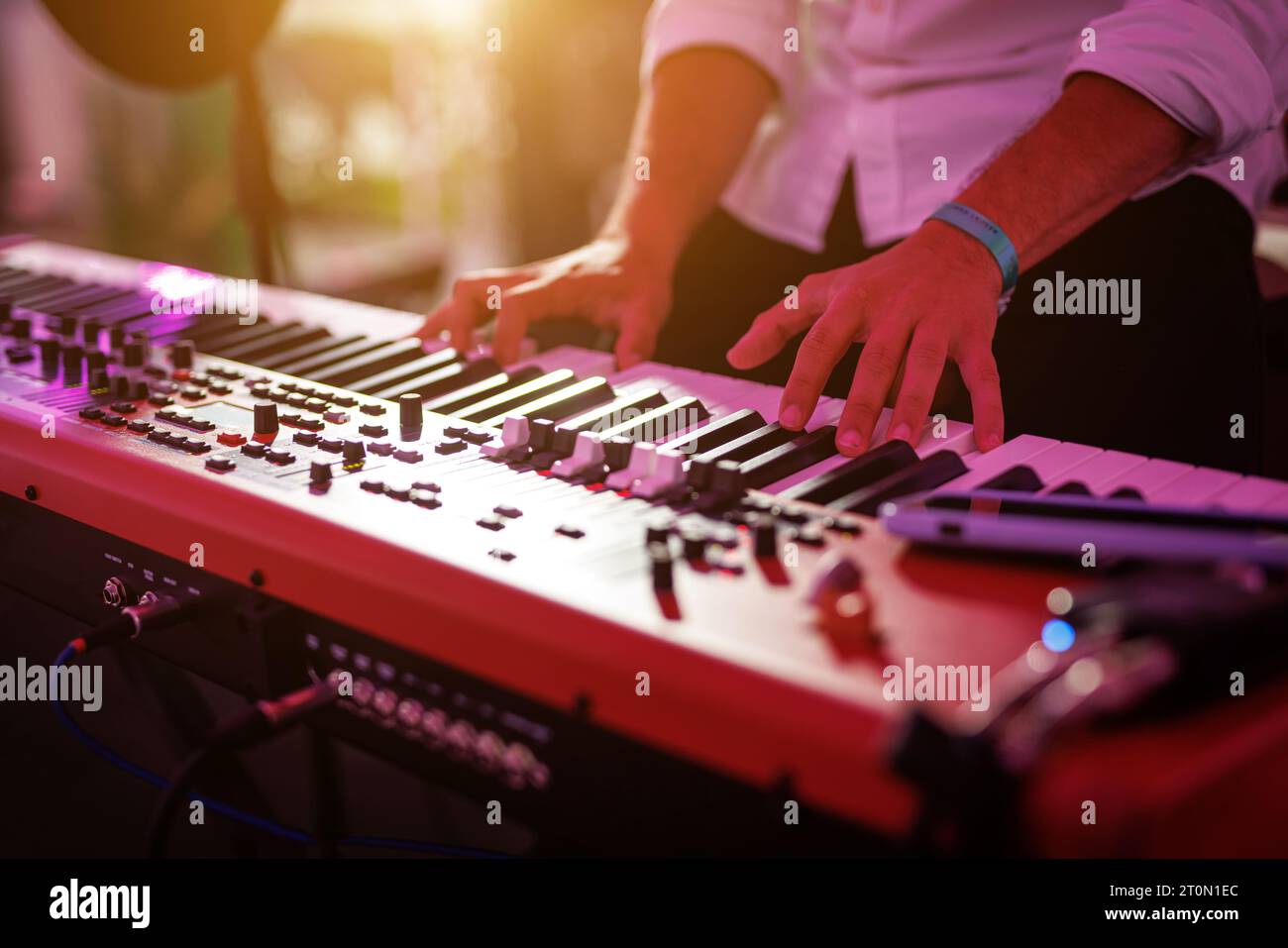 Close-Up: Hands of a Pianist or Keyboardist from a Rock Band Playing a ...