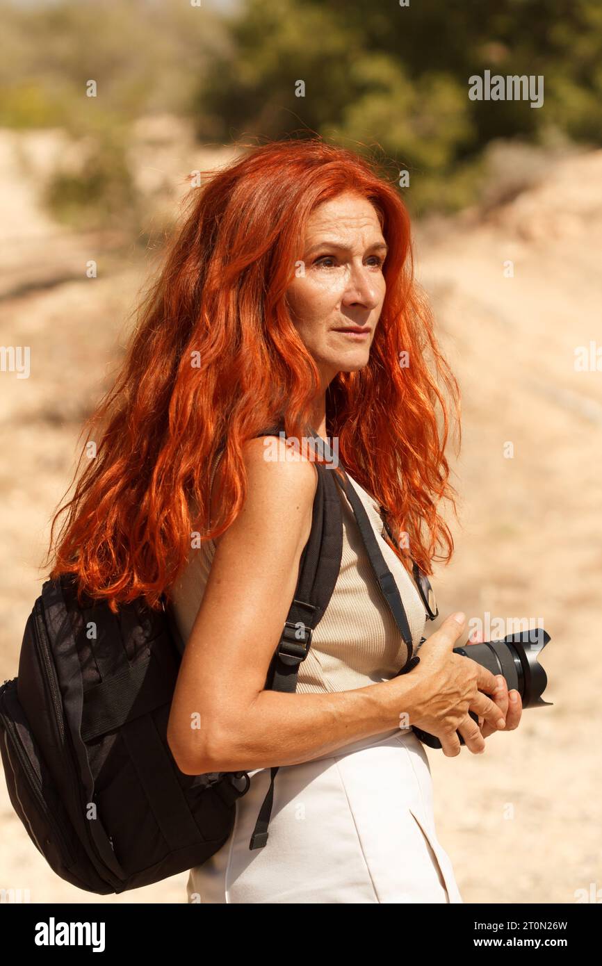 Photography professional observing his surroundings to carry out the ...