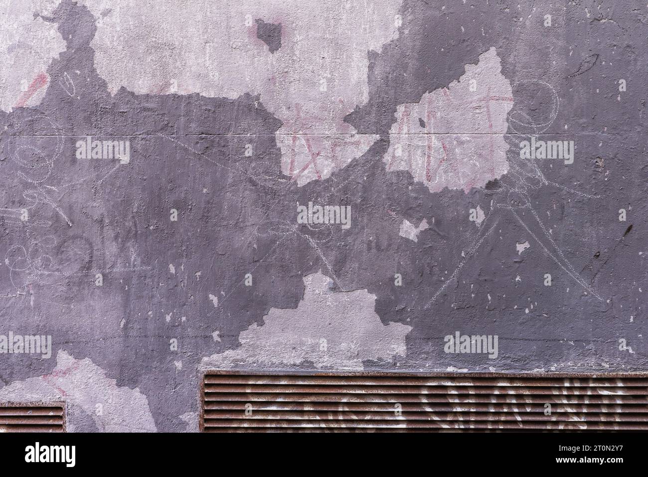 A cement wall with many paint stains, chalk and large chips Stock Photo ...