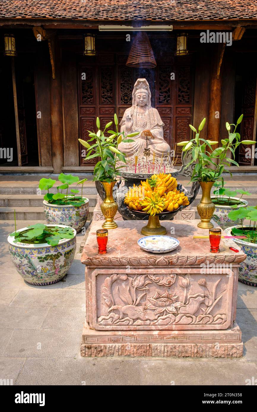 Hanoi, Vietnam. Quan Am Statue, a bodhisattva, in courtyard of Dien Huu ...