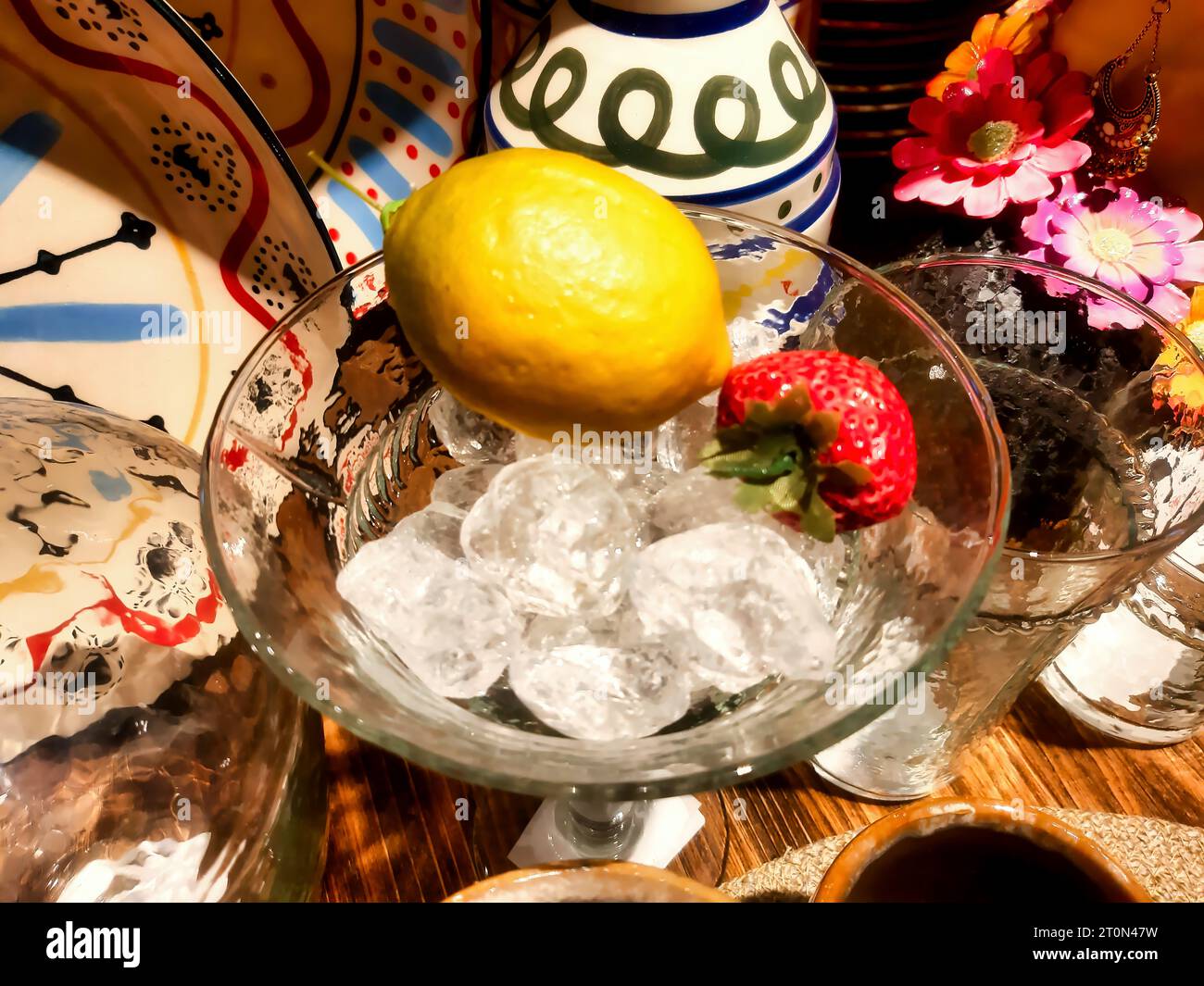 a setup for decoration purposes with cups and fruits, close up image ...