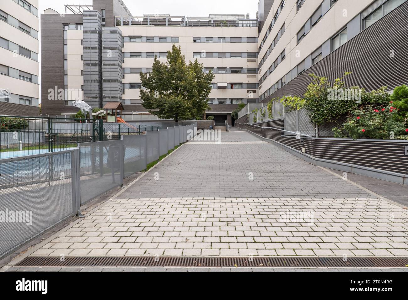 Community pool and children's play area in the interior patio of ...