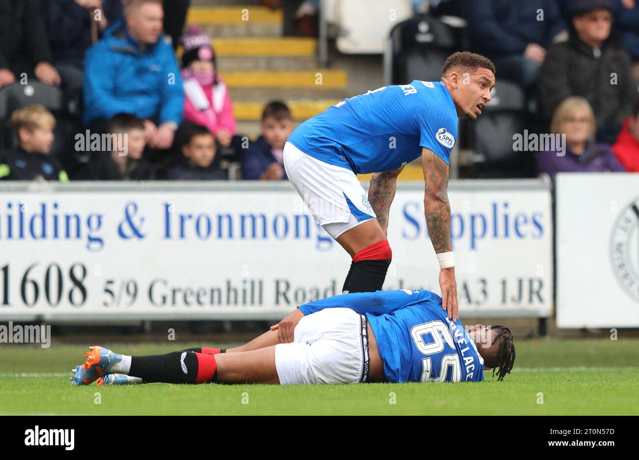 Rangers' Zak Lovelace appears in pain as Rangers' James Tavernier looks ...