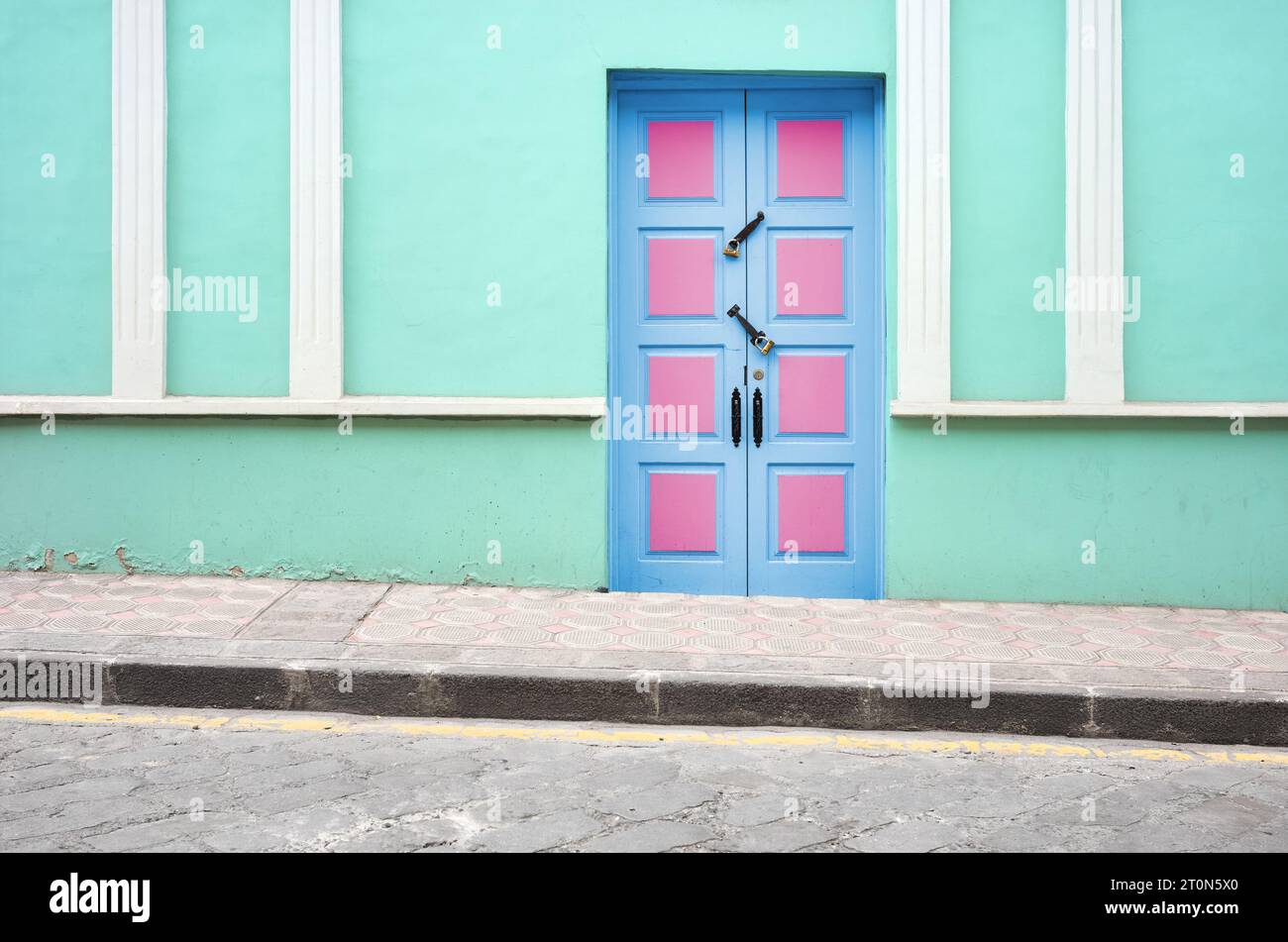 Street view of an old colonial building facade with wooden door ...