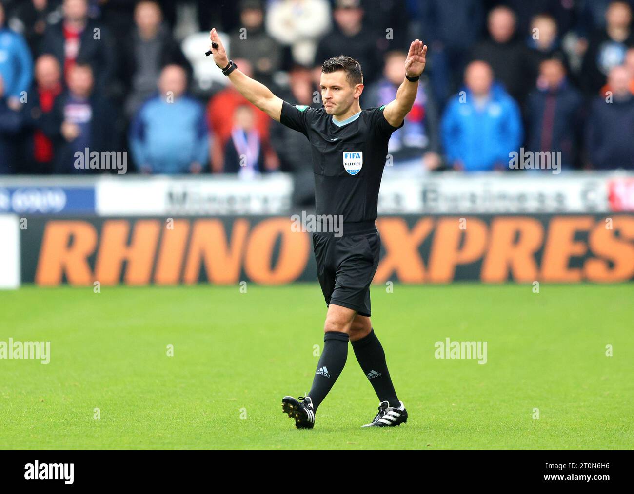 Referee Nick Walsh signals for a penalty following a VAR check on a ...