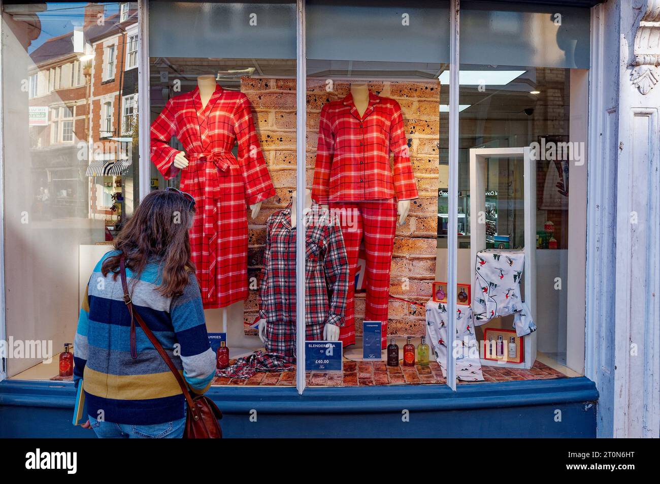 Female window shopper in Sidmouth Devon Stock Photo - Alamy
