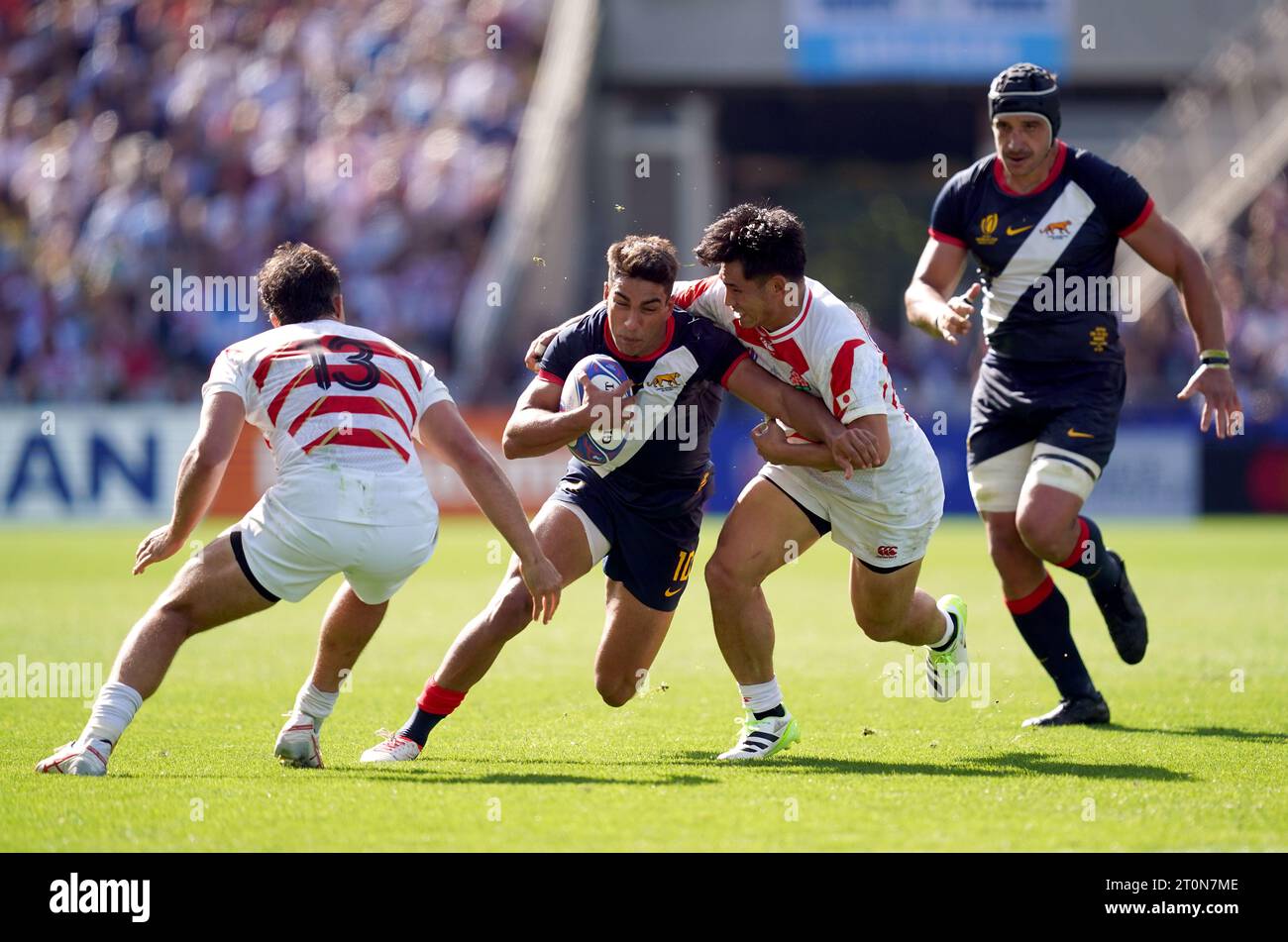 Argentina's Santiago Carreras is tackled by Japan's Ryoto Nakamura and ...