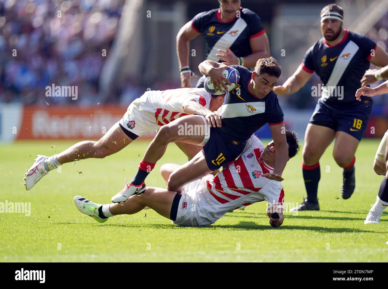 Argentina's Santiago Carreras is tackled by Japan's Ryoto Nakamura and ...