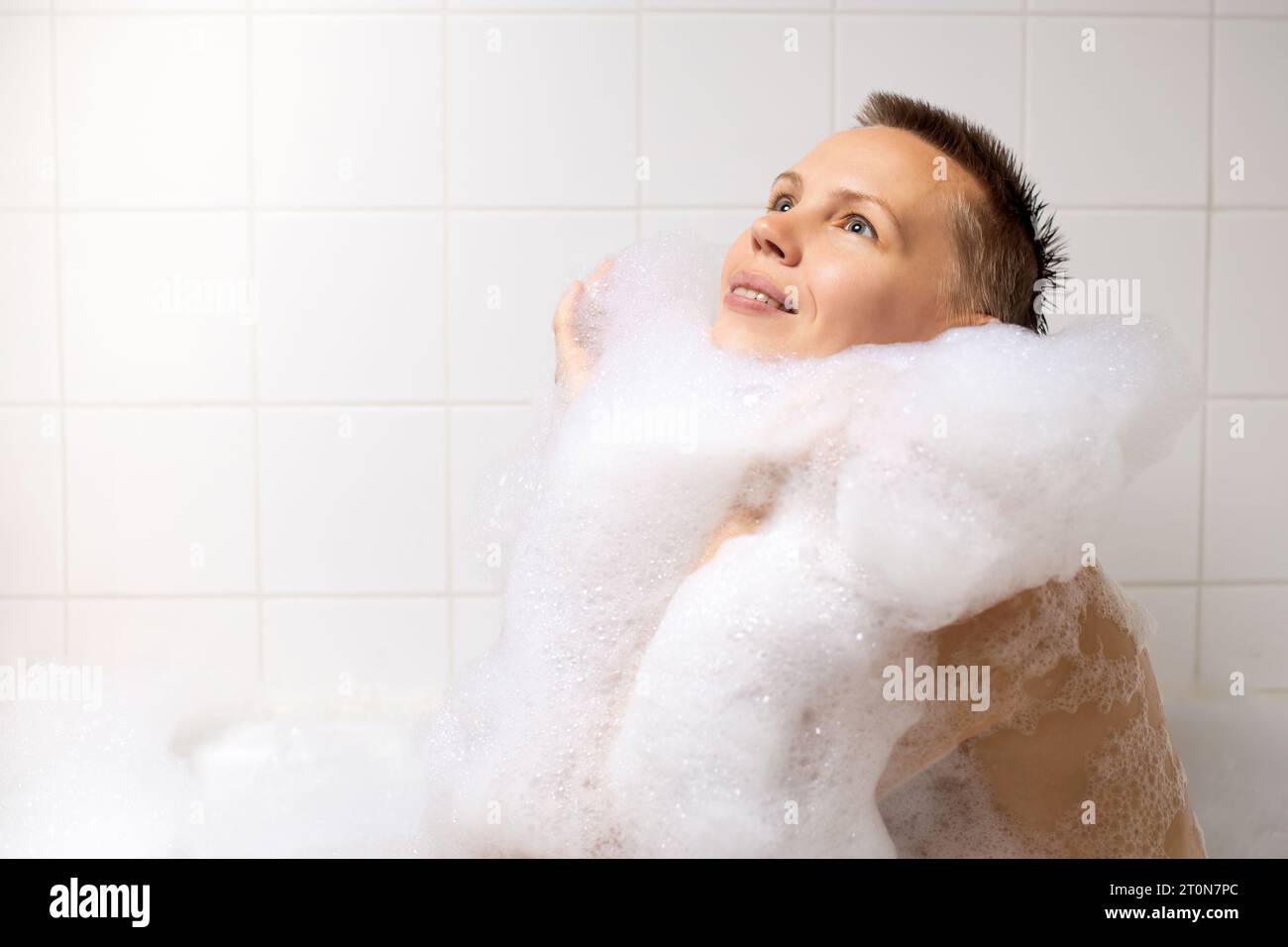 Woman aged wash face soap hi-res stock photography and images - Alamy