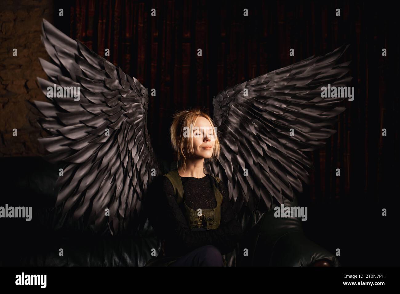 A woman with black angel wings represents the power of temptation Stock ...