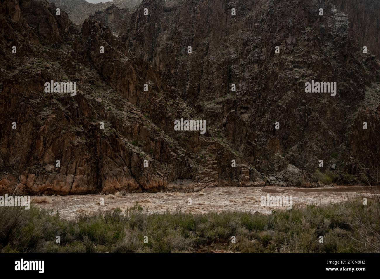 Muddy Waters of the Colorado Flow Through Granite Rapids as Snow Falls ...