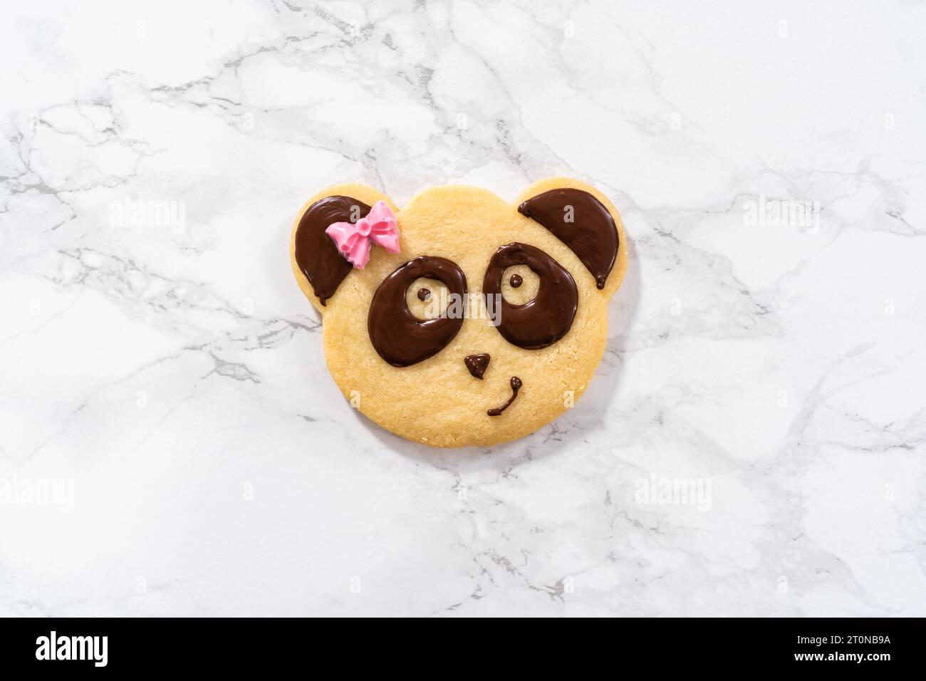 Panda shaped shortbread cookies with chocolate icing Stock Photo - Alamy