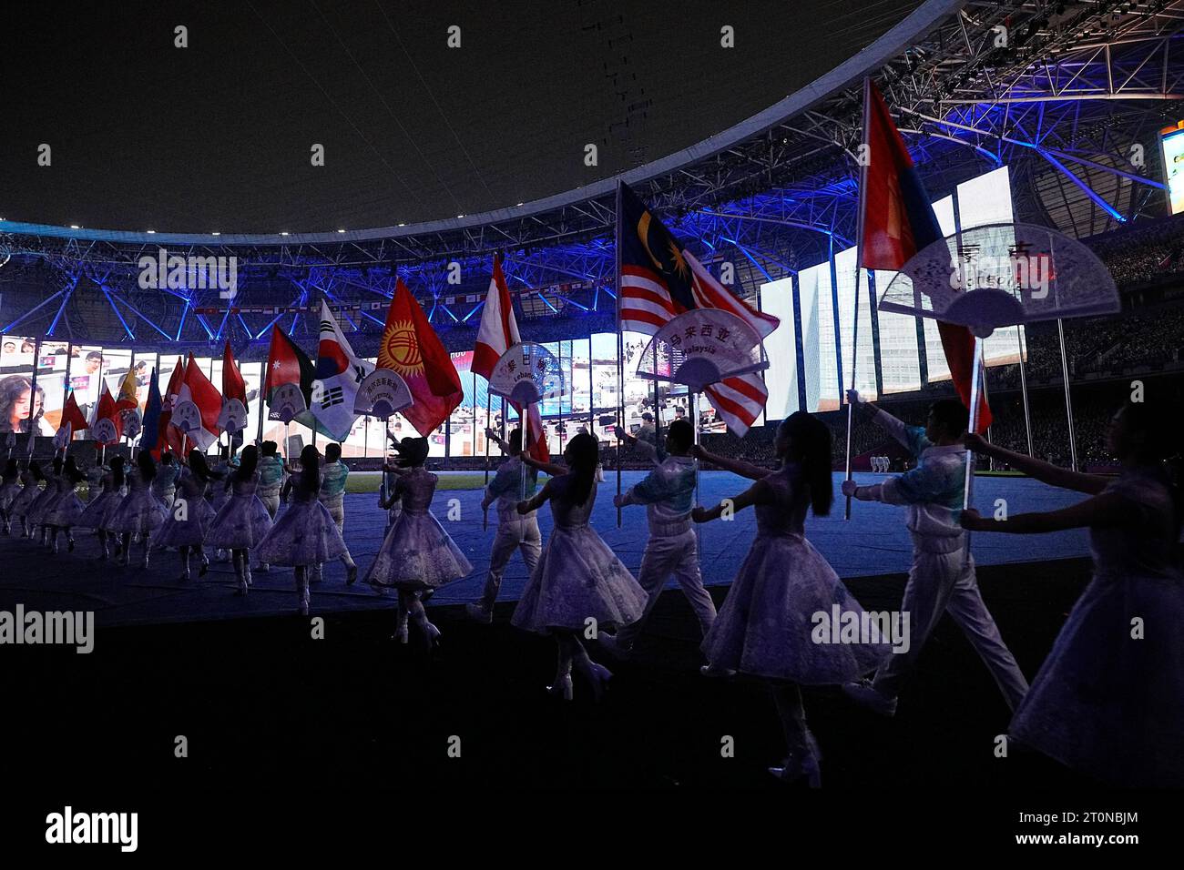 Flags of participating countries are carried during the closing ...