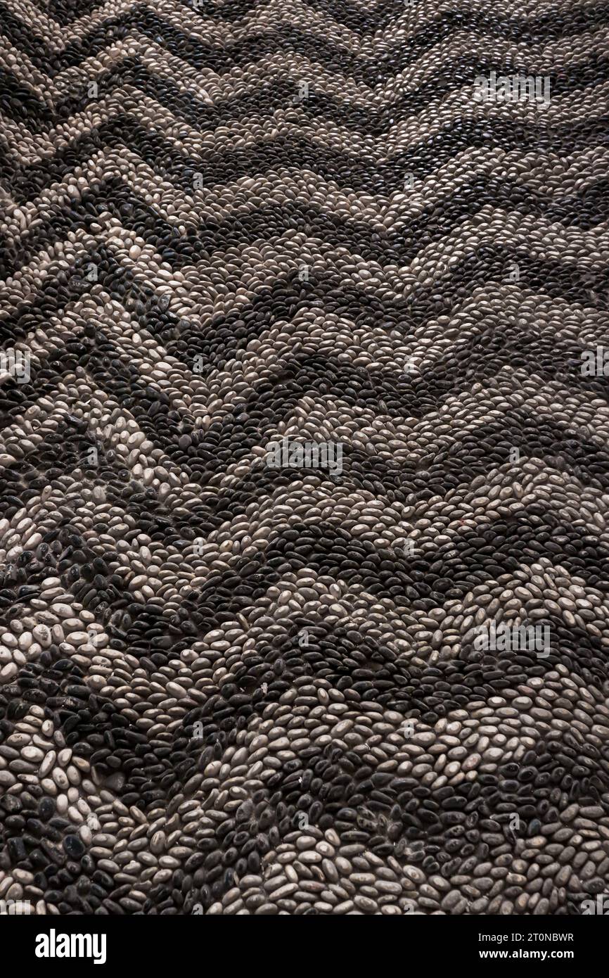 Round cobblestone rocks creating a chevron pattern walking path in The ...
