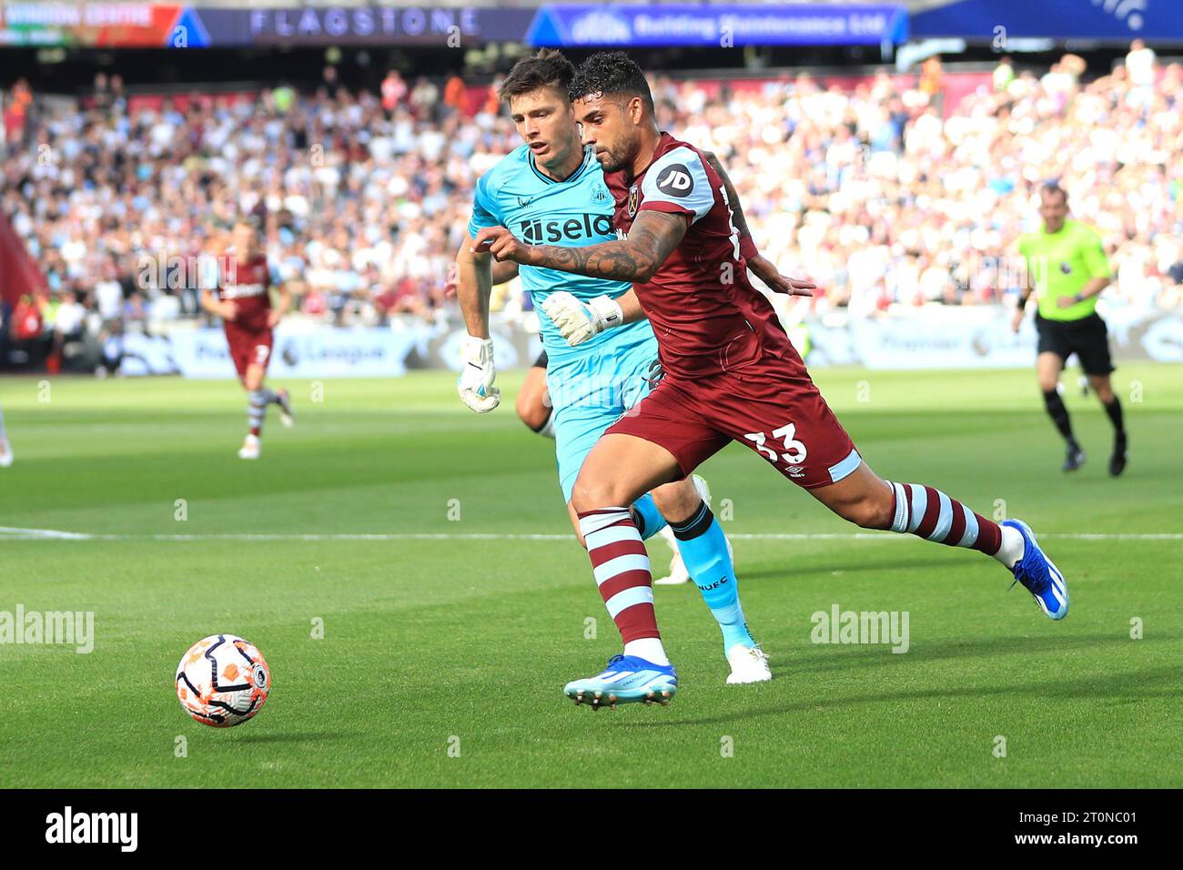 West Ham United's Emerson Palmieri (right) gets past Newcastle United goalkeeper Nick Pope to ...
