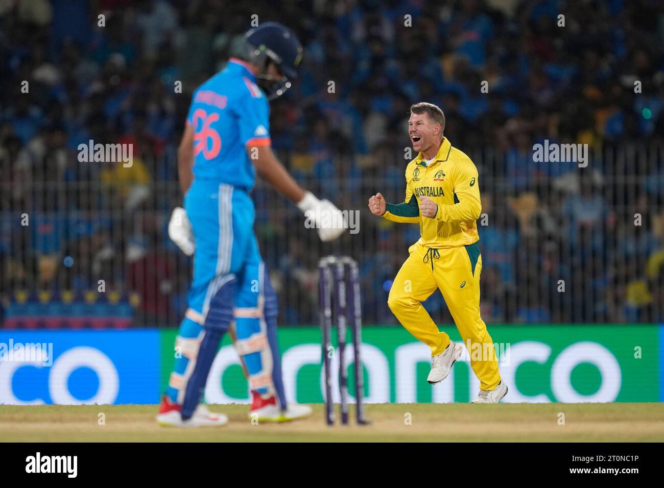 Australia's David Warner, right, celebrates the dismissal of India's ...