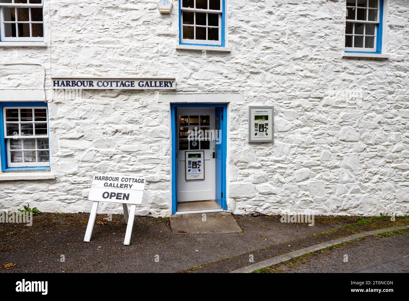 Blue framed windows and entrance way, plus sign to the Harbour Cottage ...