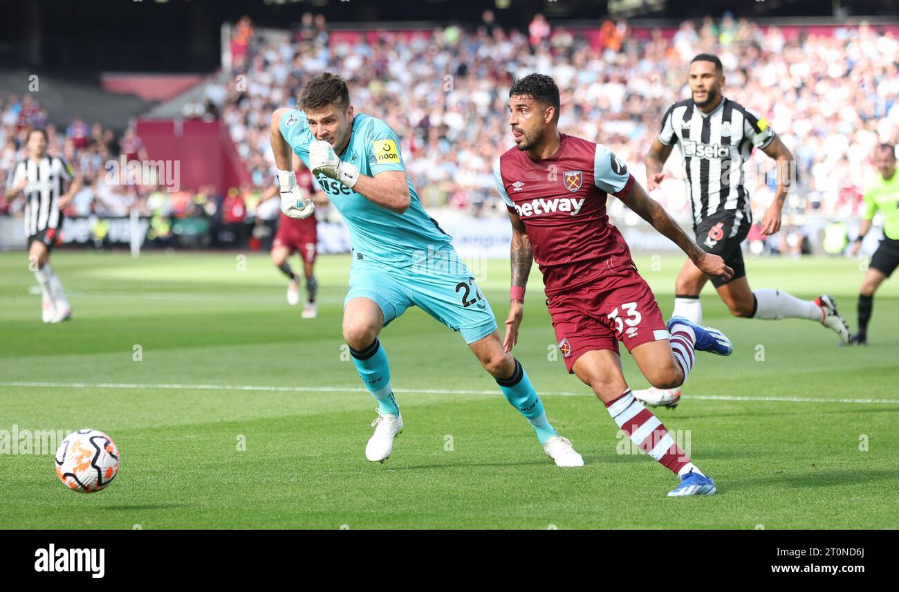 London, UK. 8th Oct, 2023. Emerson Palmieri of West Ham United takes the ball around Nick Pope ...