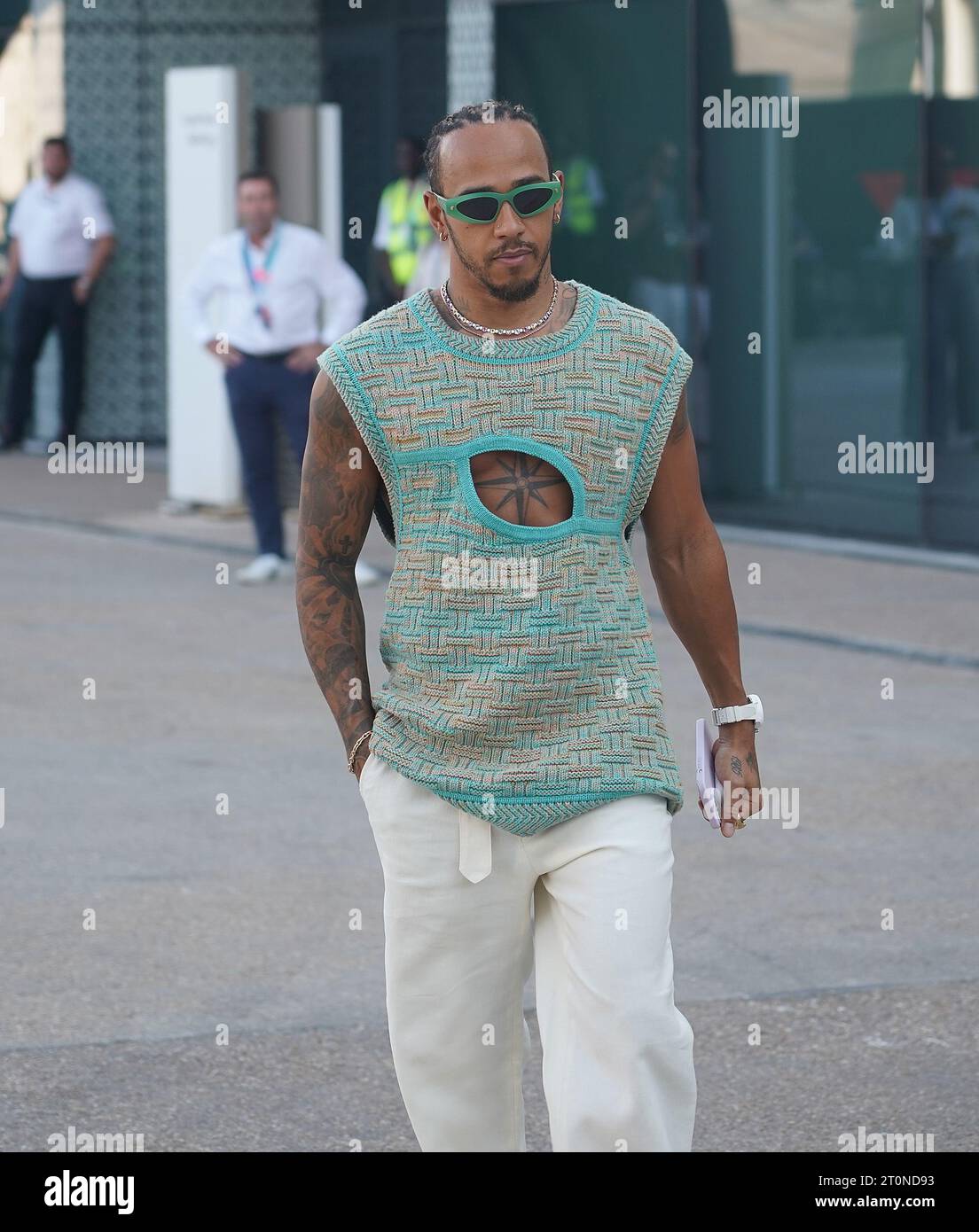 Lewis hamilton arrives in the paddock hi-res stock photography and ...