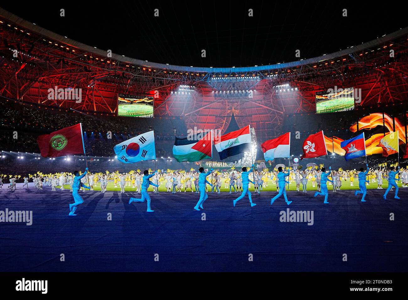 Flags of the participating countries are carried during the closing ...