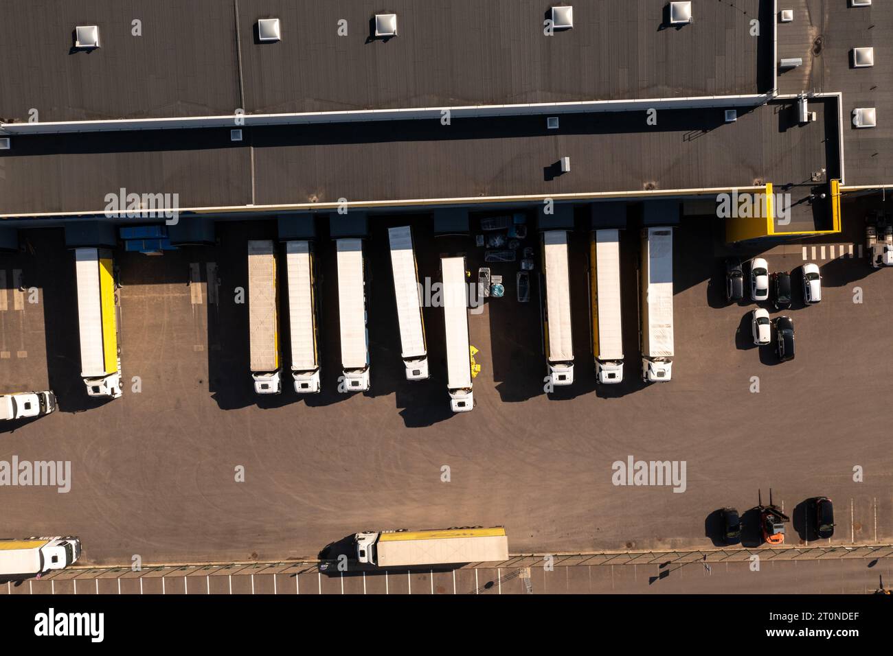 Drone photography of logistic warehouse and parked lorry's during ...