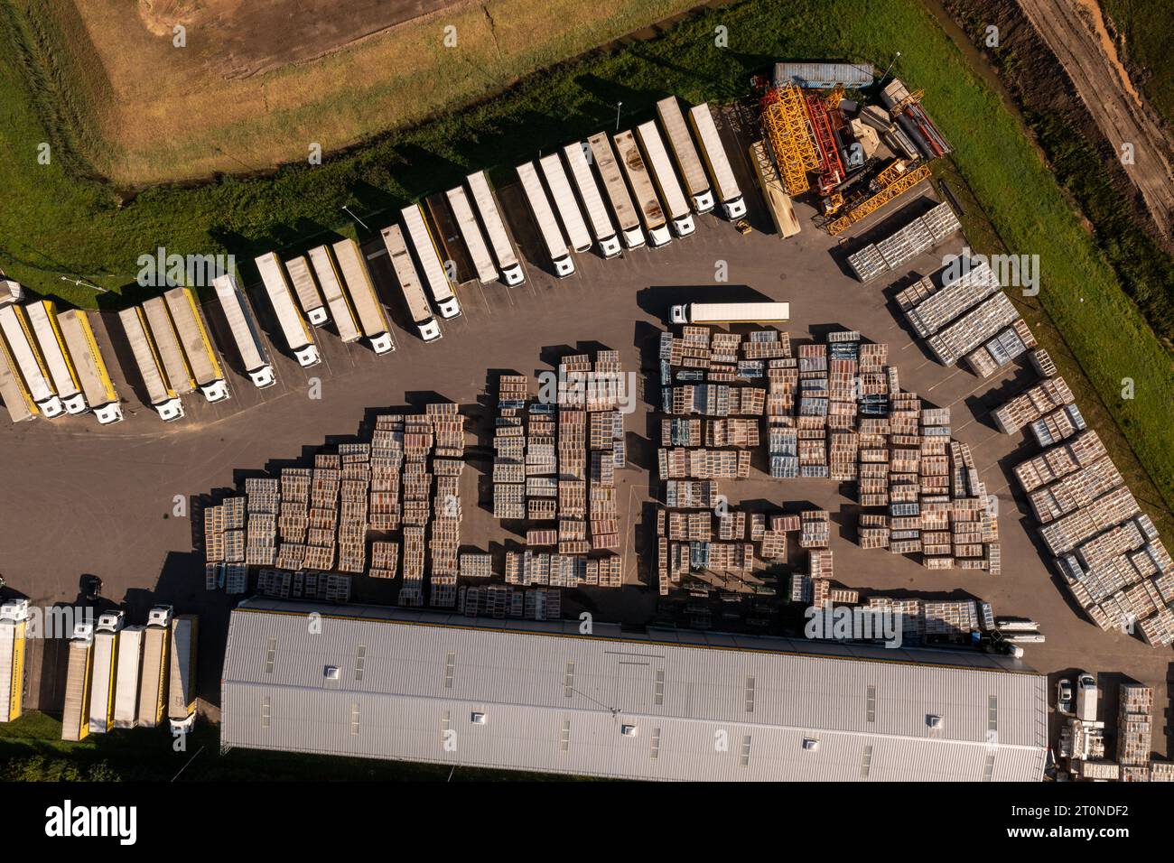 Drone photography of logistic warehouse and parked lorry's during ...