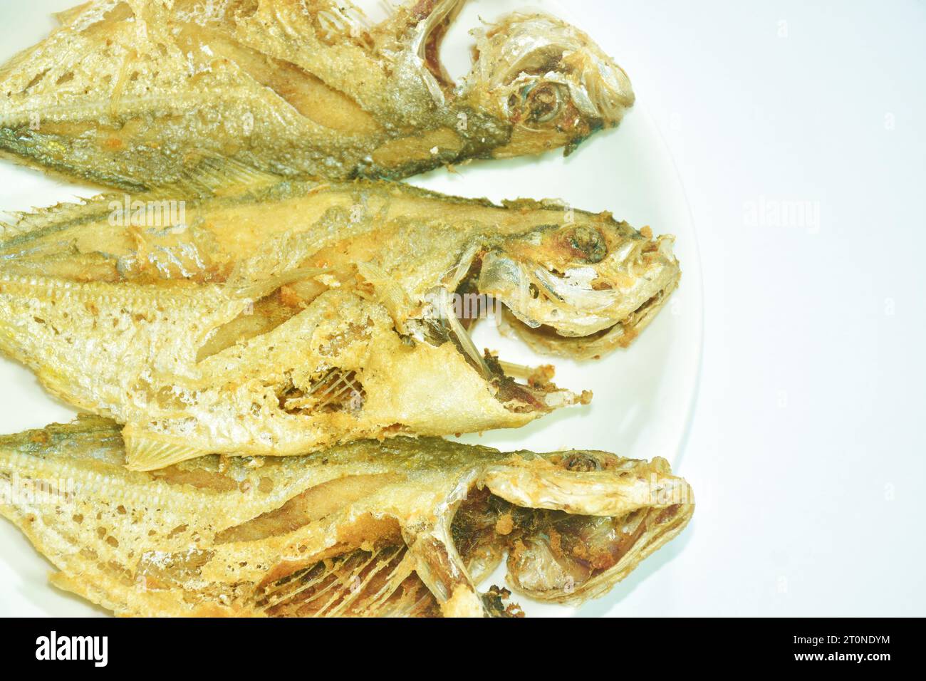 deep fried giant kingfish arranging on plate in white background Stock ...