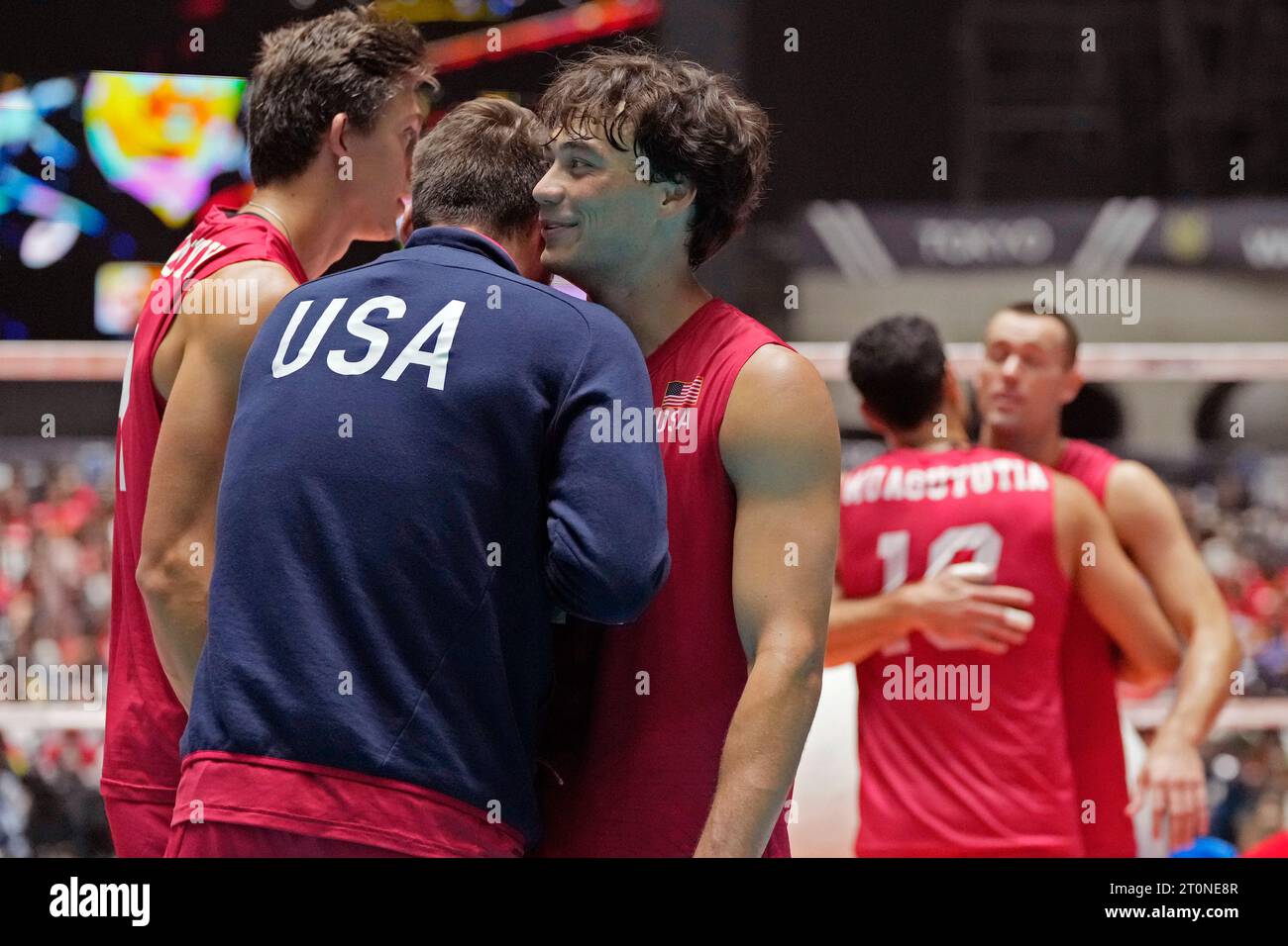 Micah Ma'a, center, his teammates celebrate after defeating Japan and ...