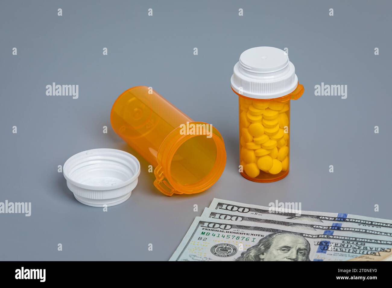 Prescription drugs and medication bottles with cash money. Healthcare ...