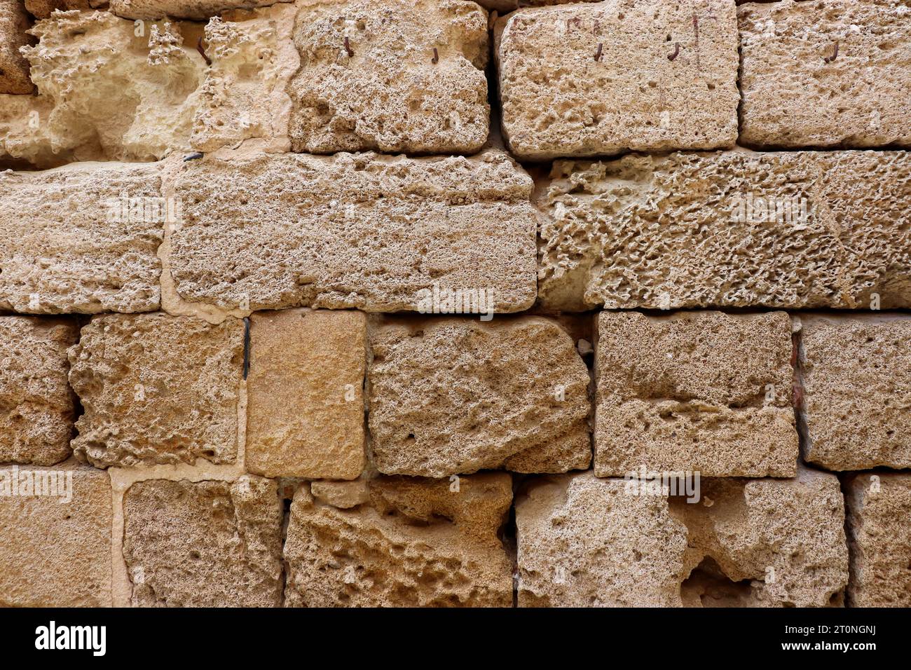 Closeup background ancient stone wall texture Stock Photo - Alamy