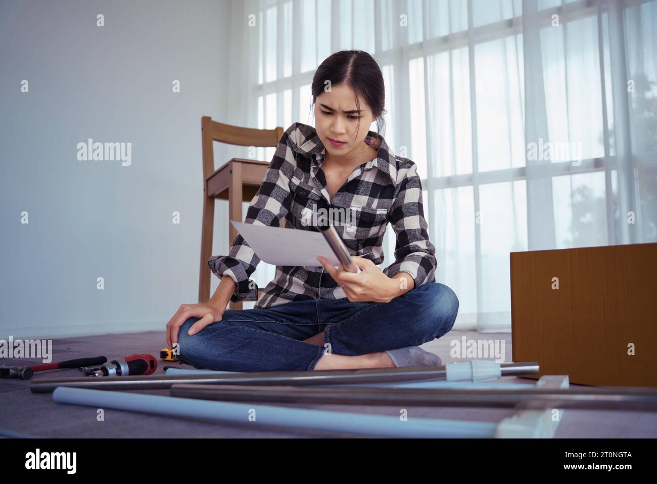 Women stressful while reading installation manual and instruction ...