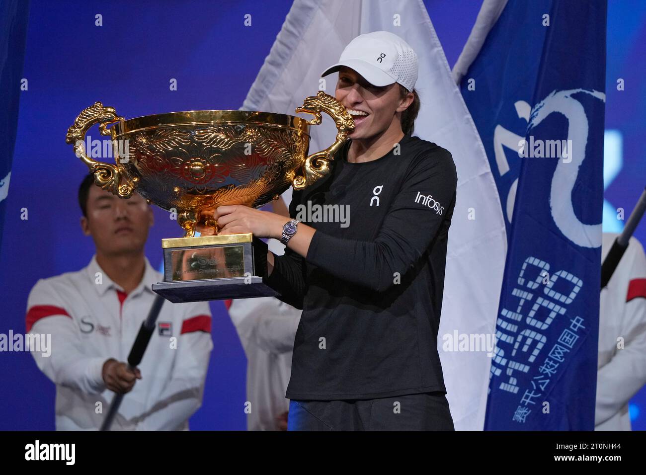 Iga Swiatek of Poland poses with her trophy on stage after winning in ...