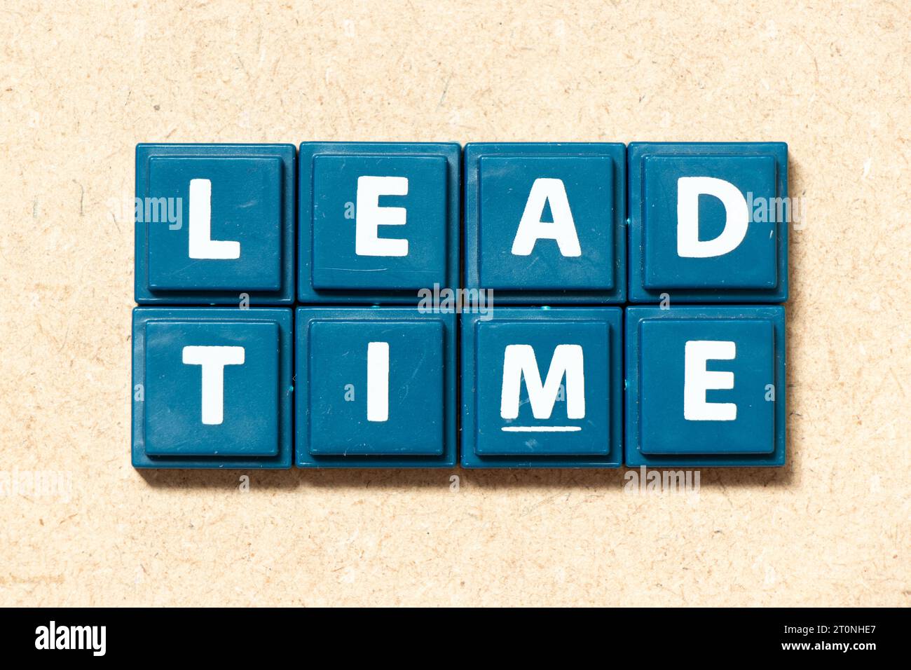 Tile alphabet letter in word lead time on wood background Stock Photo ...